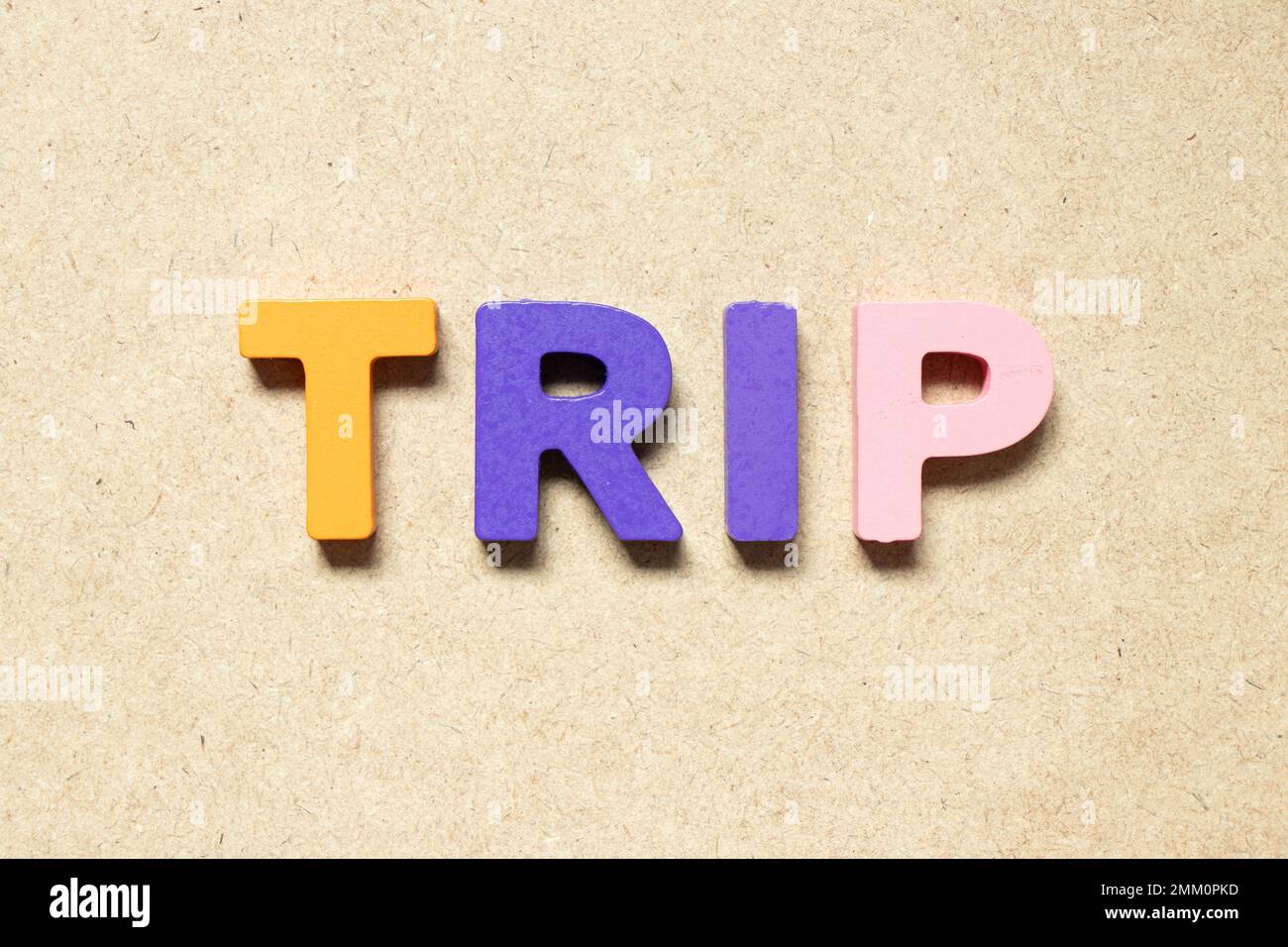 Color alphabet letter in word trip on wood background Stock Photo - Alamy
