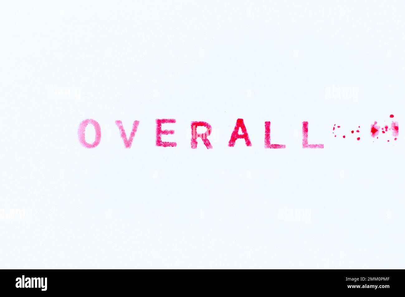 Red color ink rubber stamp in word overall on white paper background ...