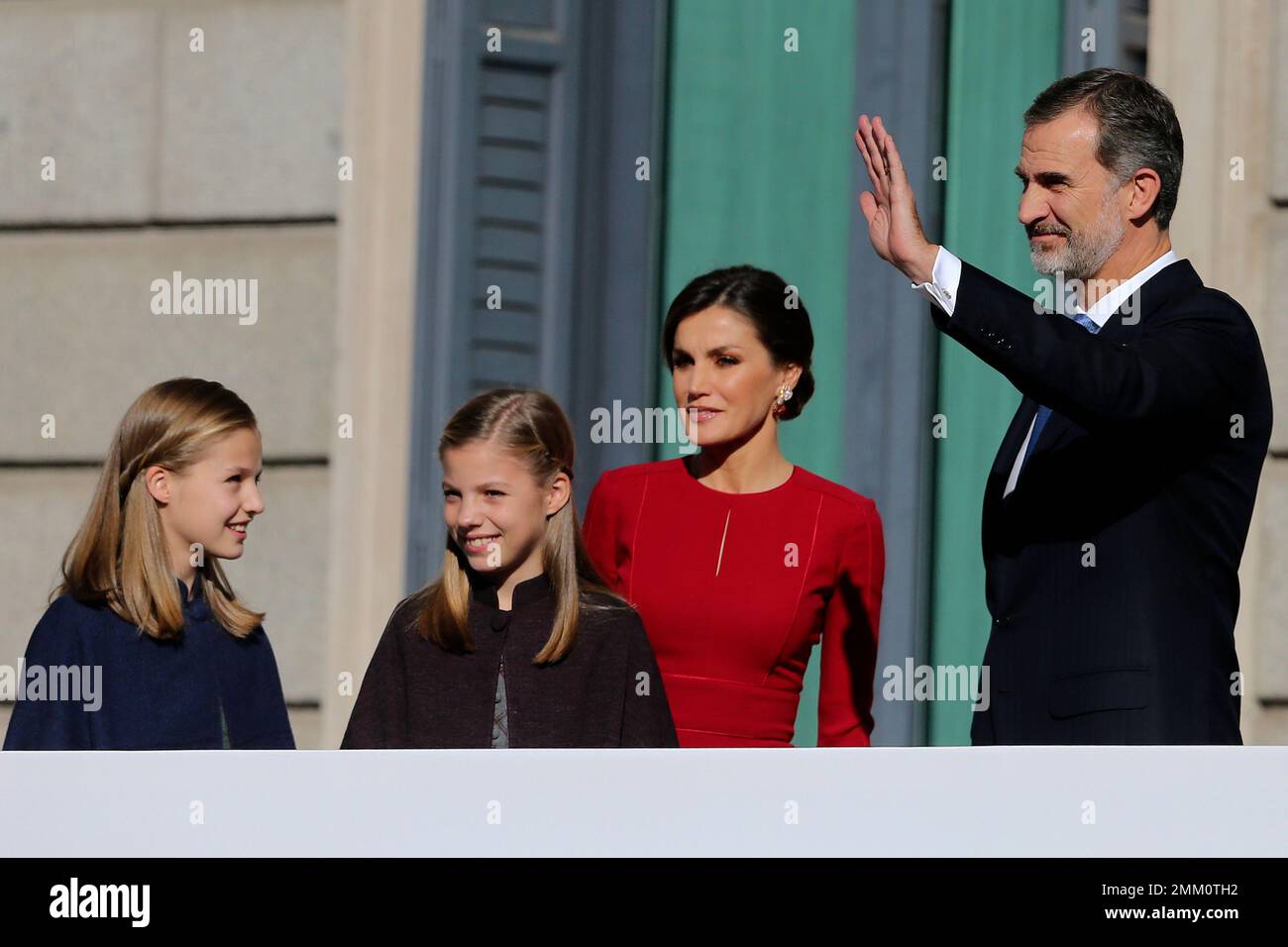 Spain's King Felipe VI and his wife Queen Letizia wave to the crowd ...