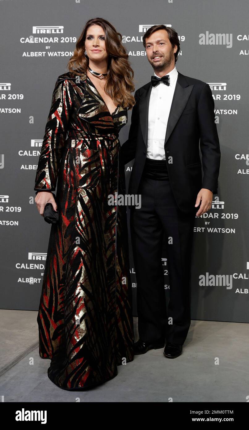 Giovanni Tronchetti Provera is flanked by his partner Nicole ...