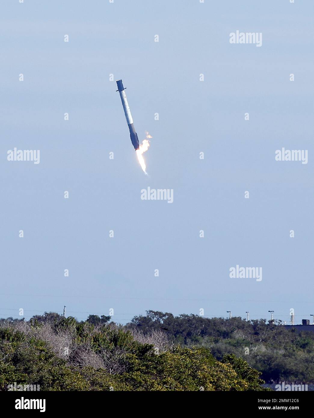 The first stage booster from a Falcon 9 rocket experiences a control ...