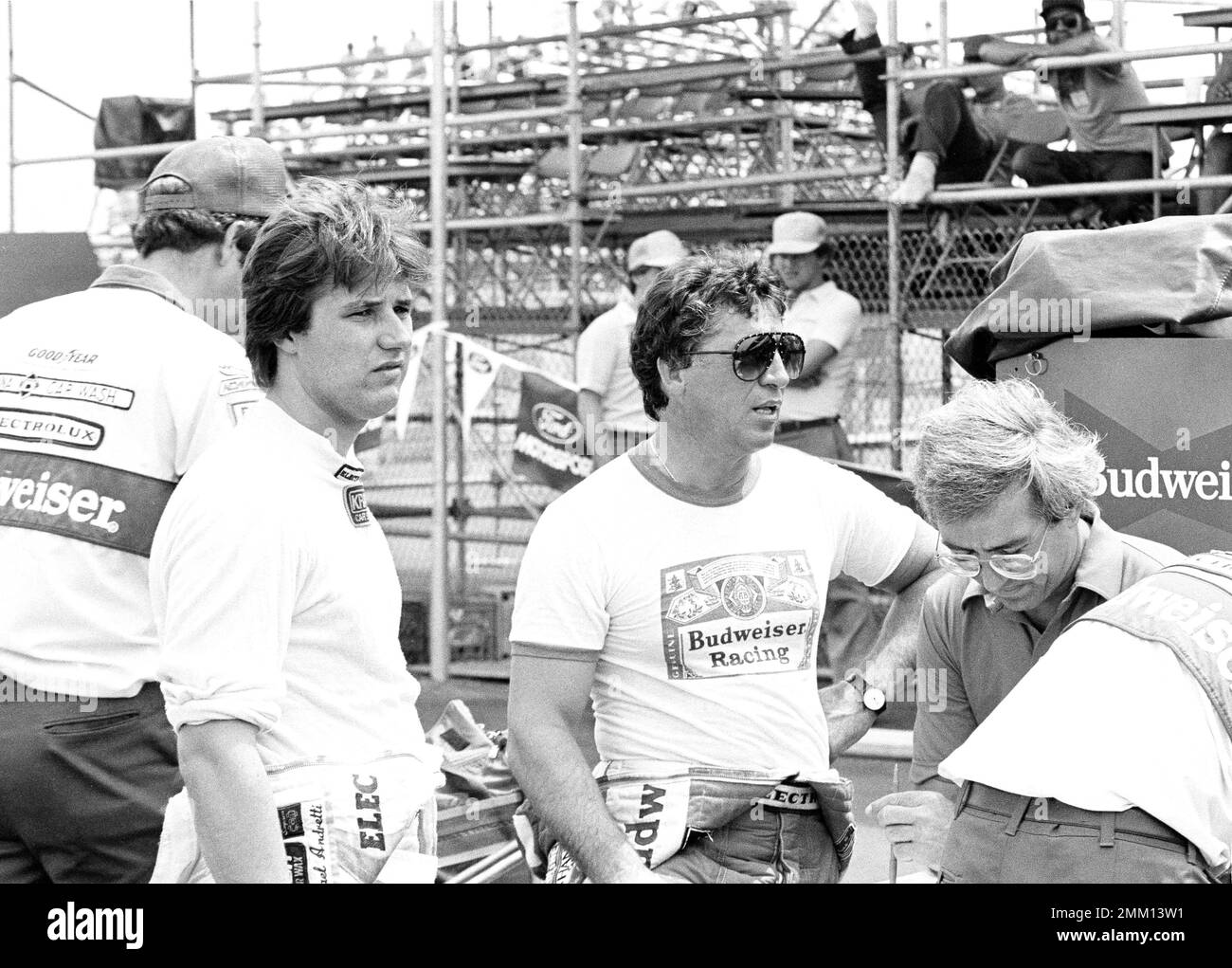 Michael, left, and his father Mario Andretti are shown in the pits ...