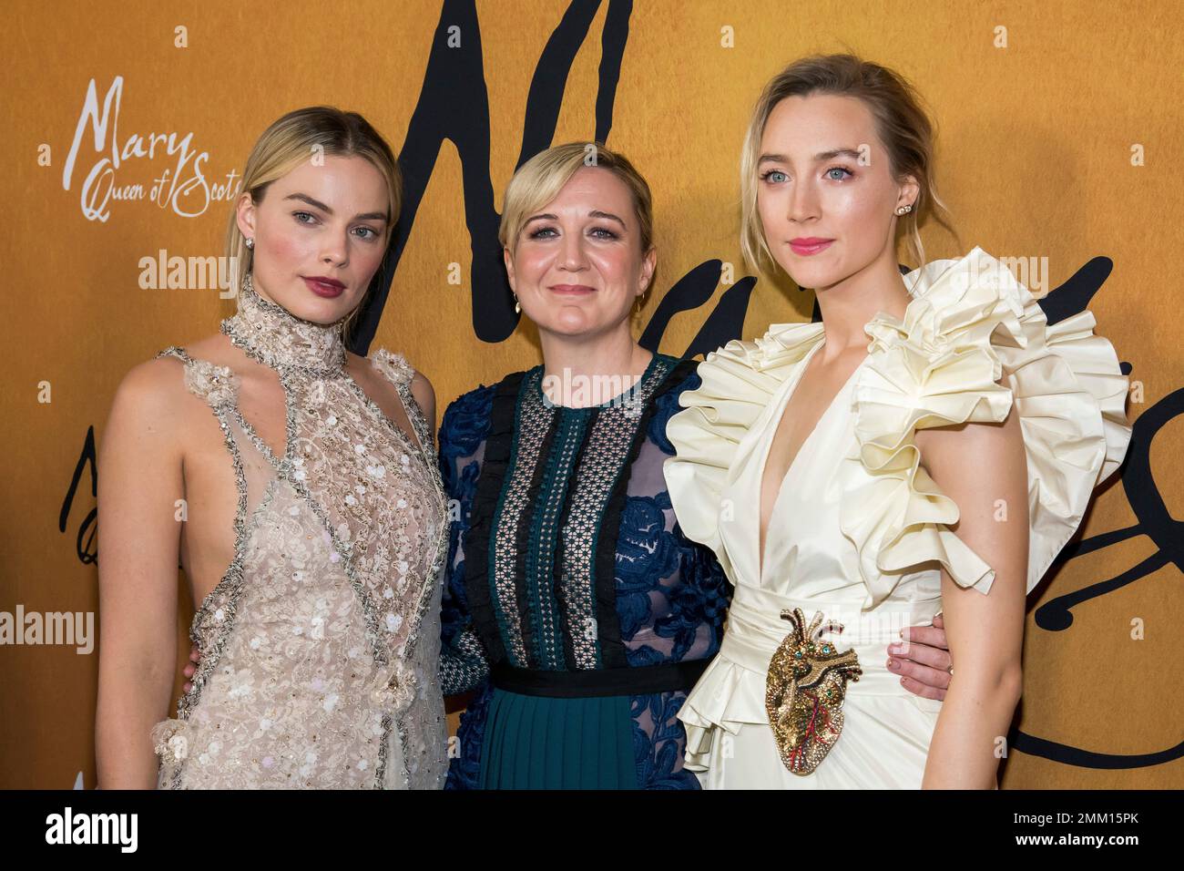 Margot Robbie, left, Josie Rourke and Saoirse Ronan attend the premiere ...