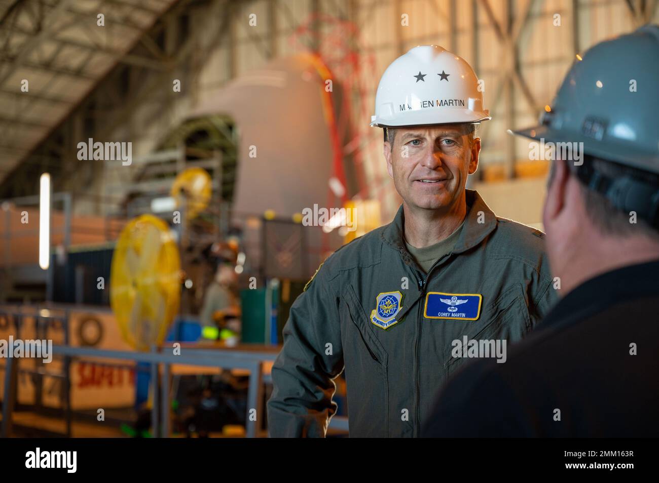 Maj. Gen. Corey Martin, 18th Air Force commander, speaks with John ...