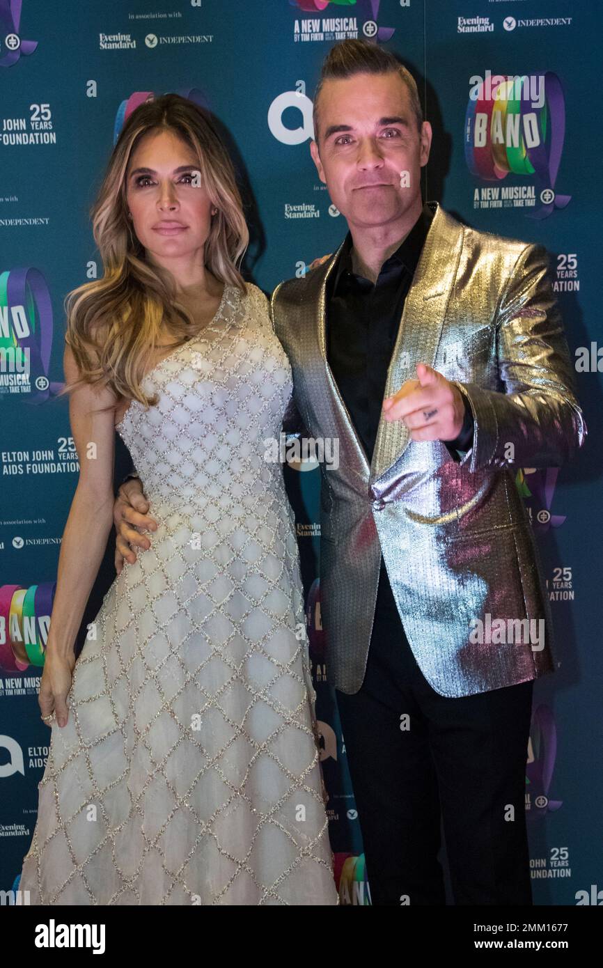 Singer Robbie Williams, right, and actress Ayda Field pose for ...