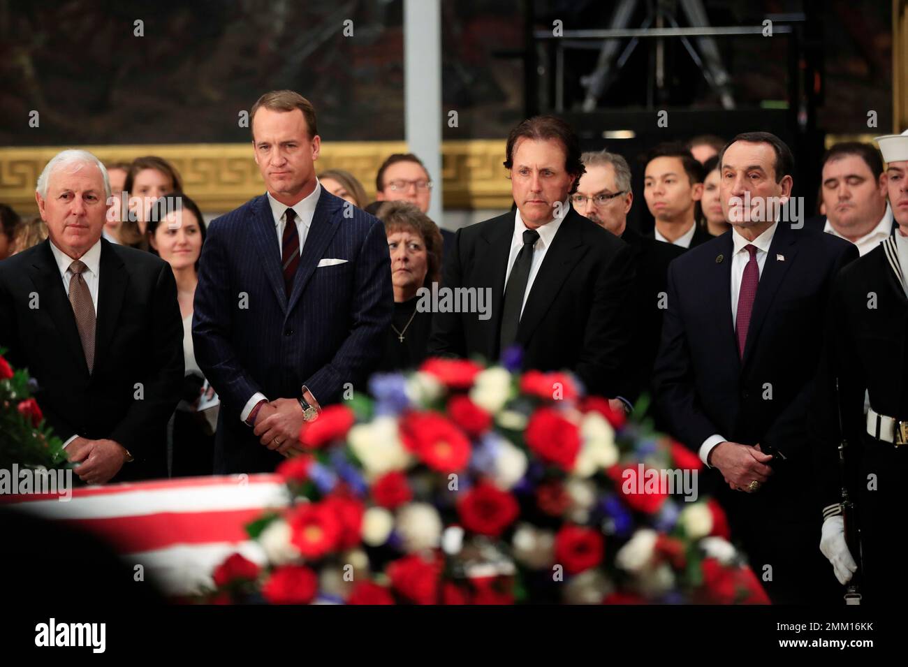 Former NFL football quarterback Peyton Manning, second from left to ...