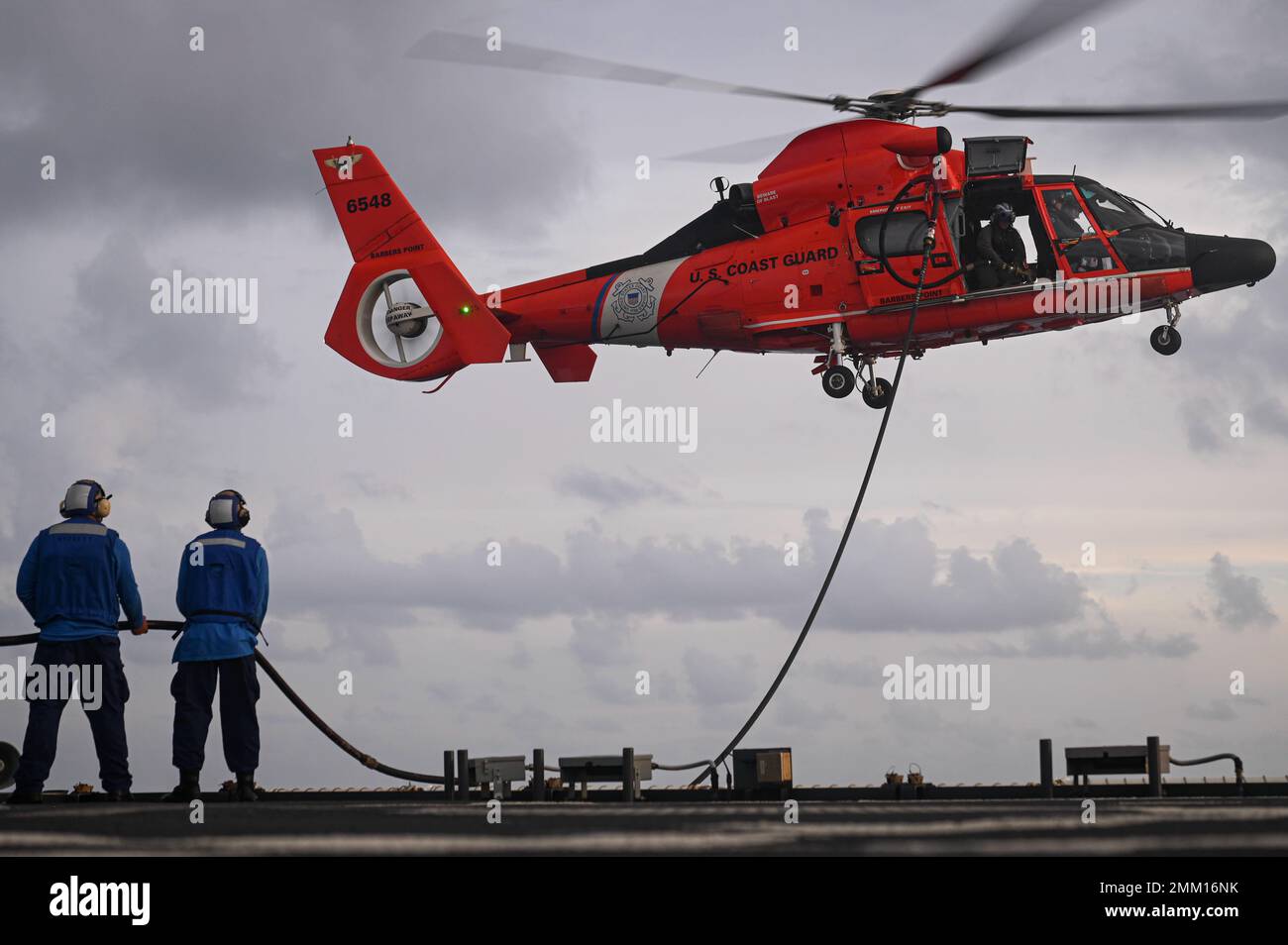 An MH-65 Dolphin helicopter from U.S. Coast Guard Air Station Barbers ...