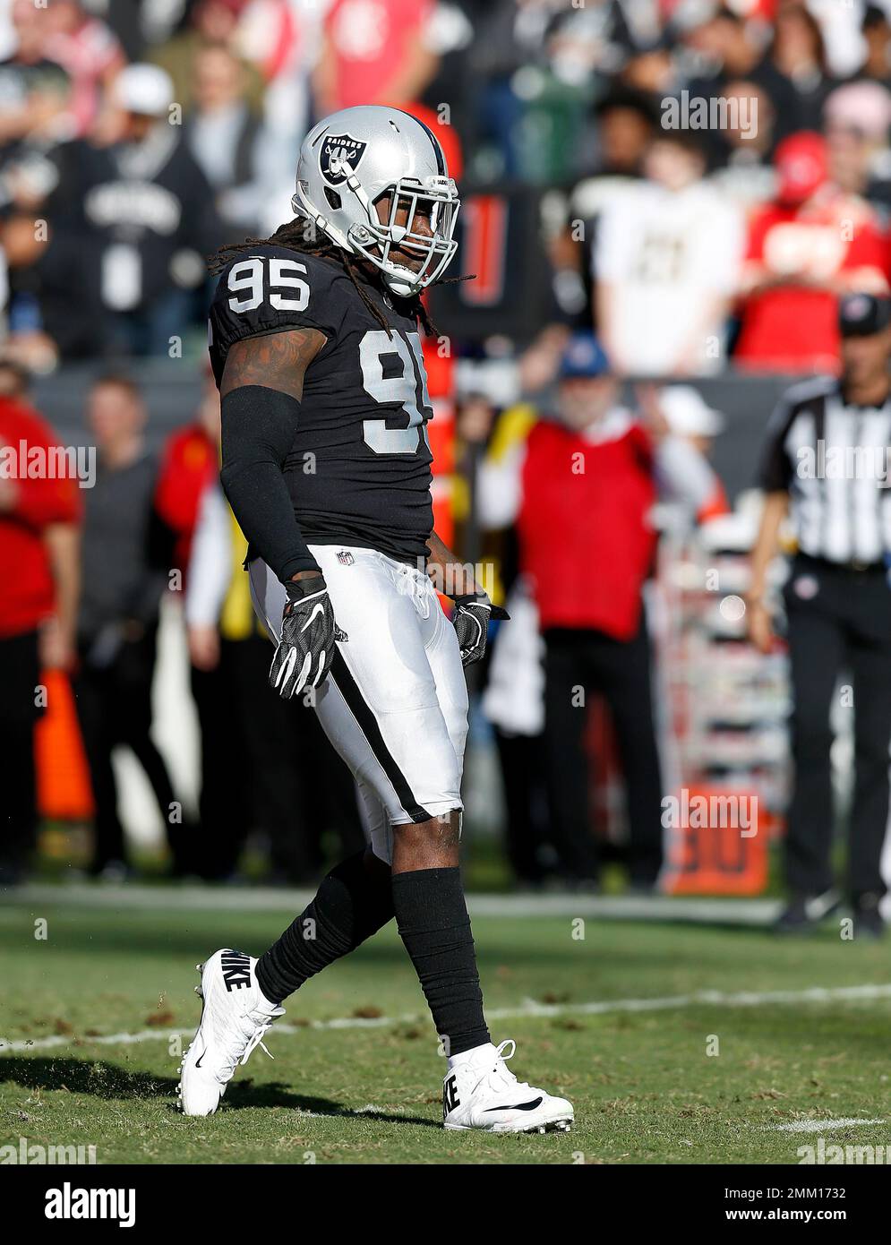 Oakland Raiders defensive end Fadol Brown (95) reacts against the ...