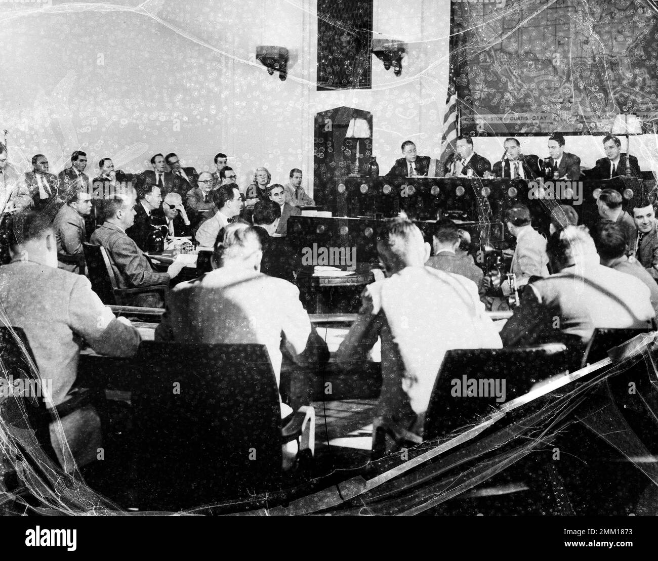 Harvard Professor Wendell H. Furry, left, hand on table, between two ...
