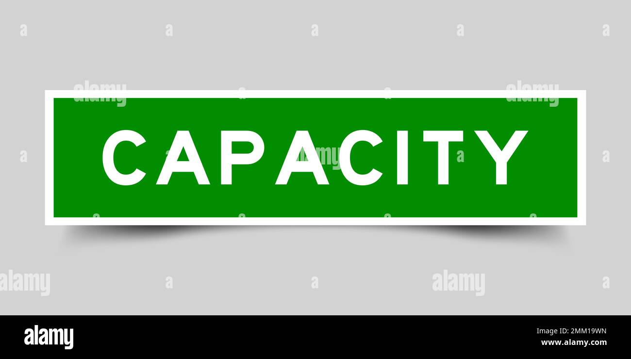 Green color square label sticker with word capacity on gray background ...