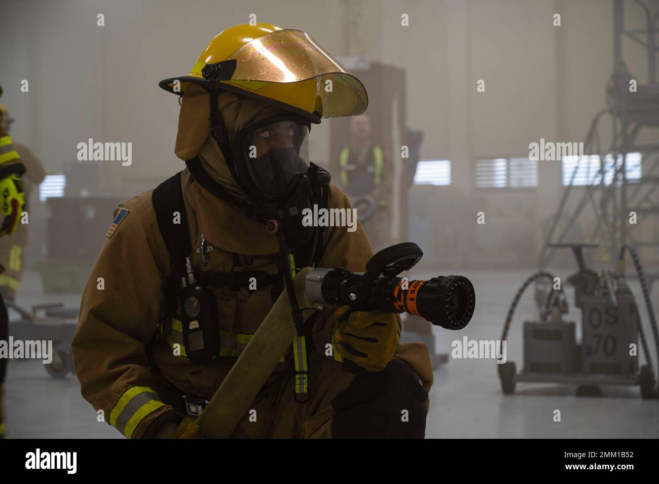 A U.S. Air Force firefighter assigned to the 36th Civil Engineer ...