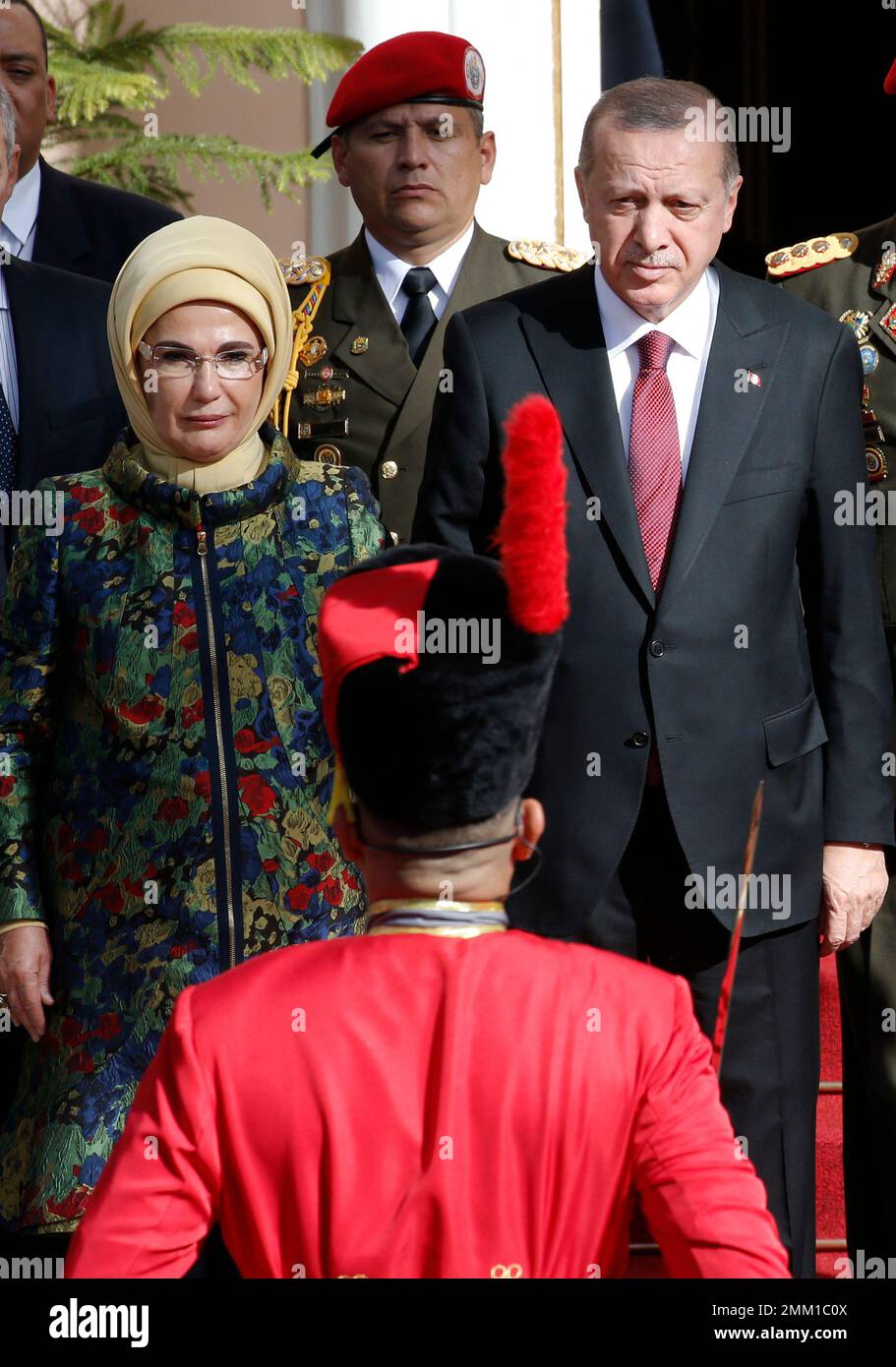 Turkey's President Recep Tayyip Erdogan, right, and his wife Ermine ...