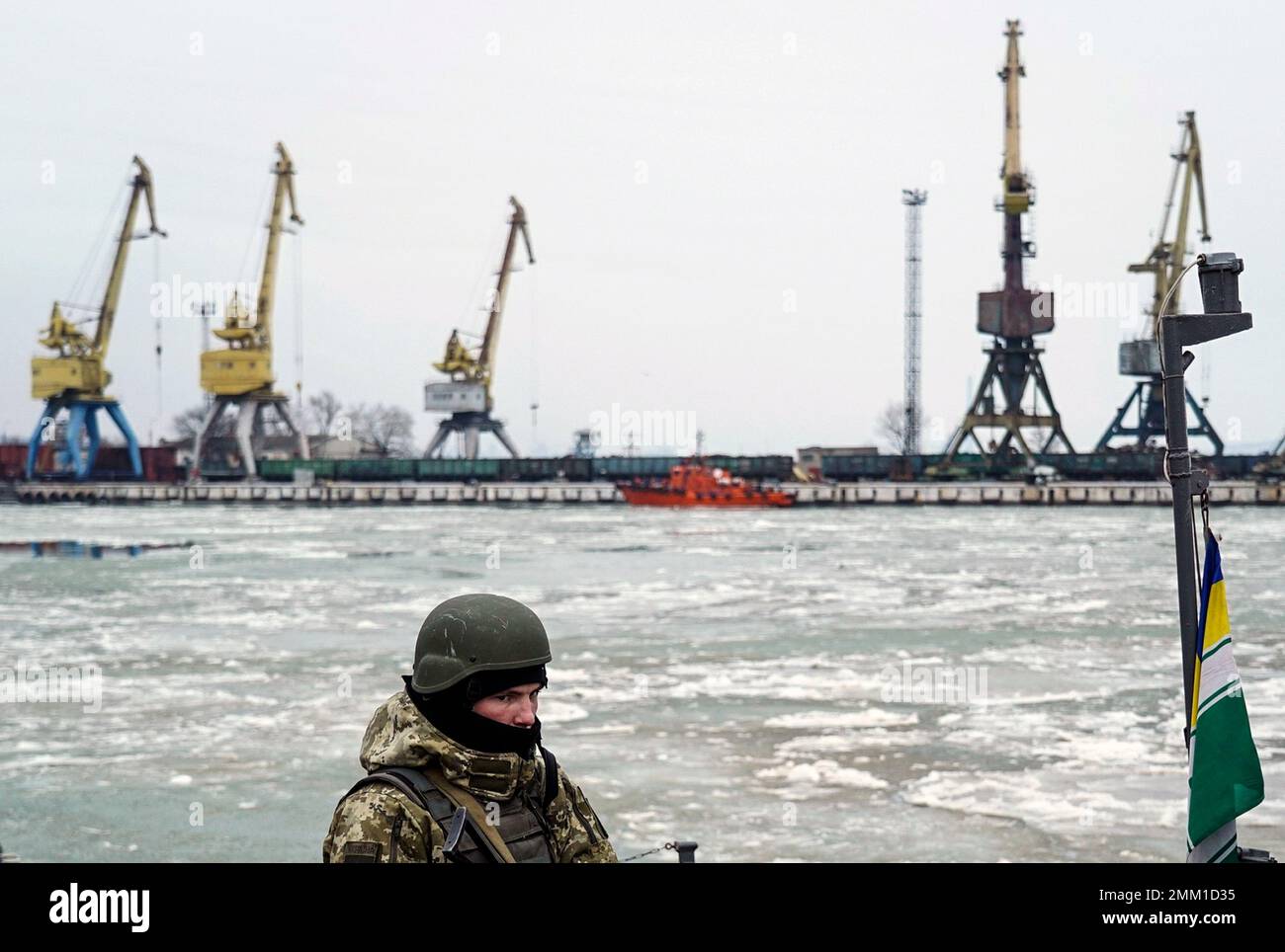 A Ukrainian serviceman stands on board a coast guard ship in the Sea of ...