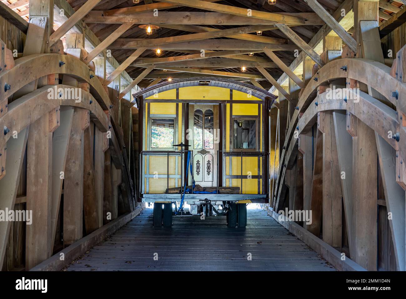 Installing a New Yellow Passenger Antique Coach Thru a Cover Bridge on ...