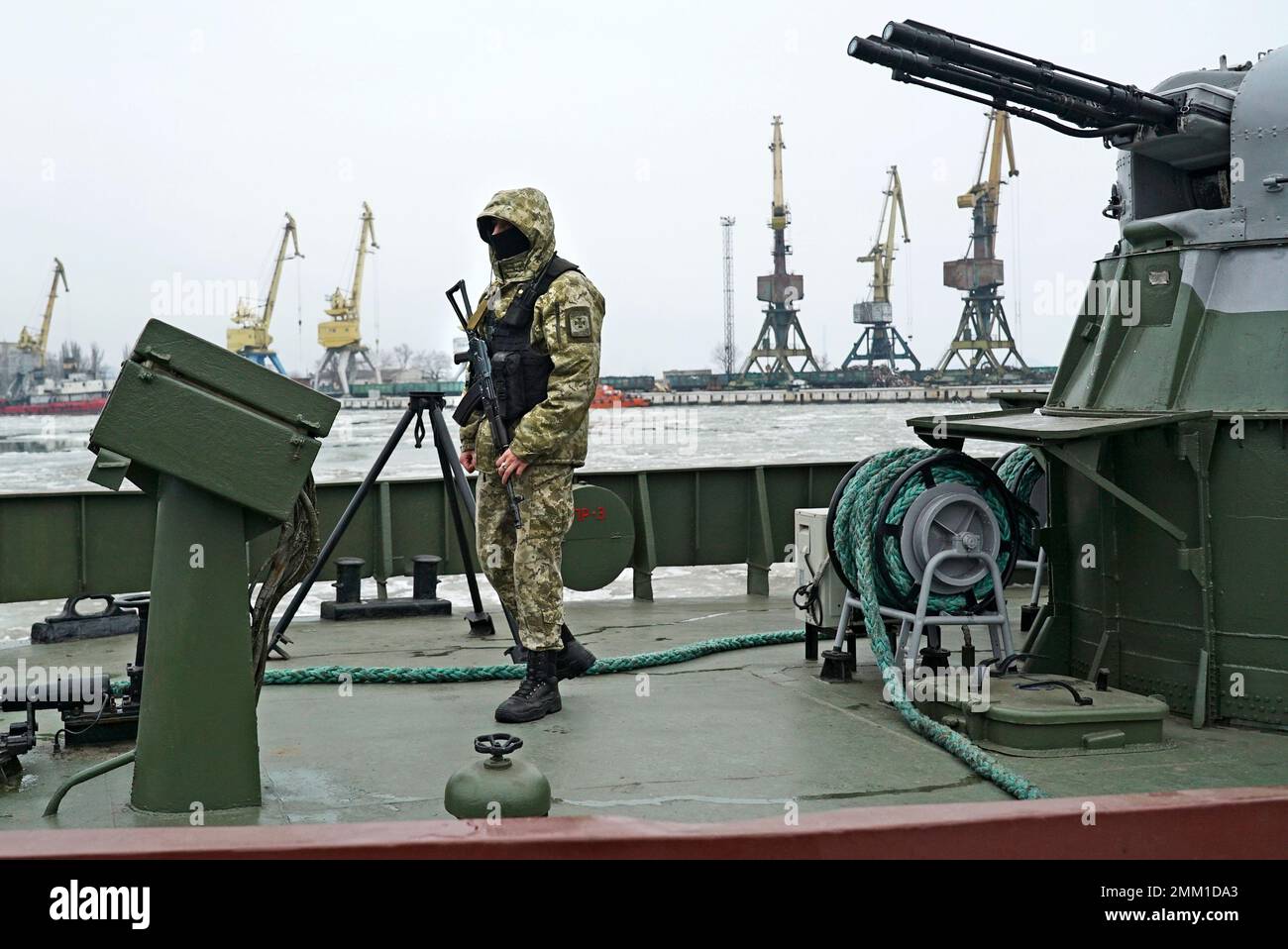 A Ukrainian serviceman stands on board a coast guard ship in the Sea of ...
