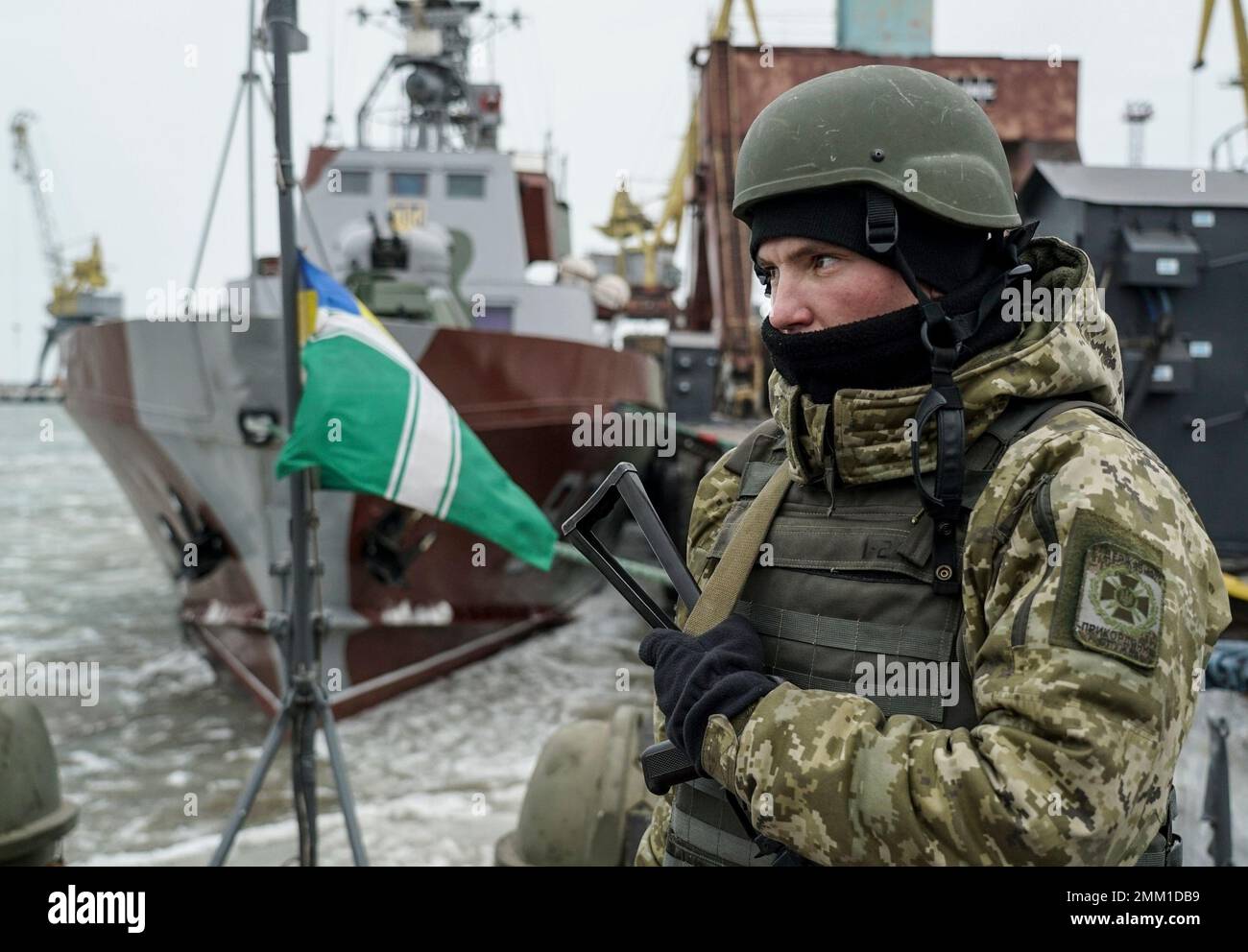 A Ukrainian serviceman stands on board a coast guard ship in the Sea of ...