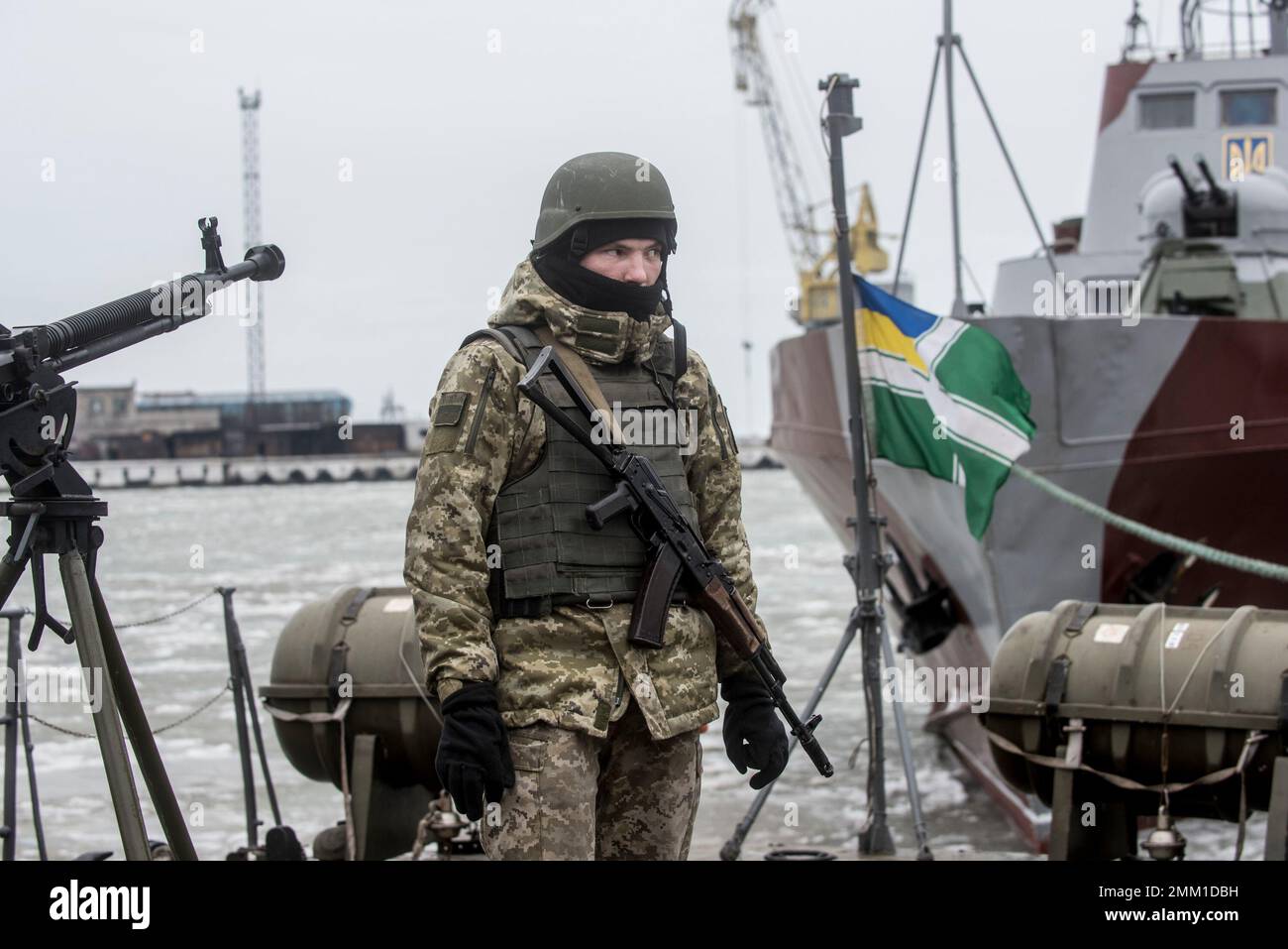 A Ukrainian serviceman stands on board a coast guard ship in the Sea of ...