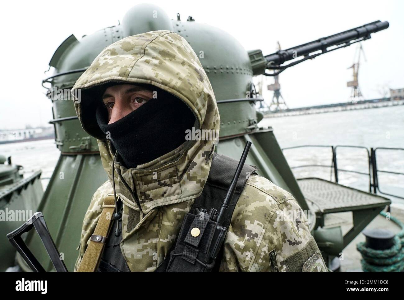 A Ukrainian serviceman stands on board a coast guard ship in the Sea of ...