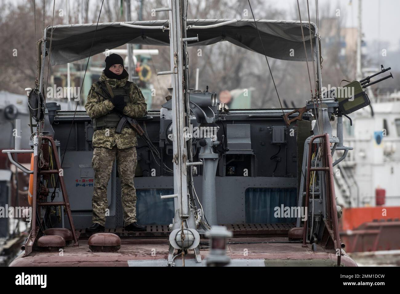 A Ukrainian serviceman stands on board a coast guard ship in the Sea of ...