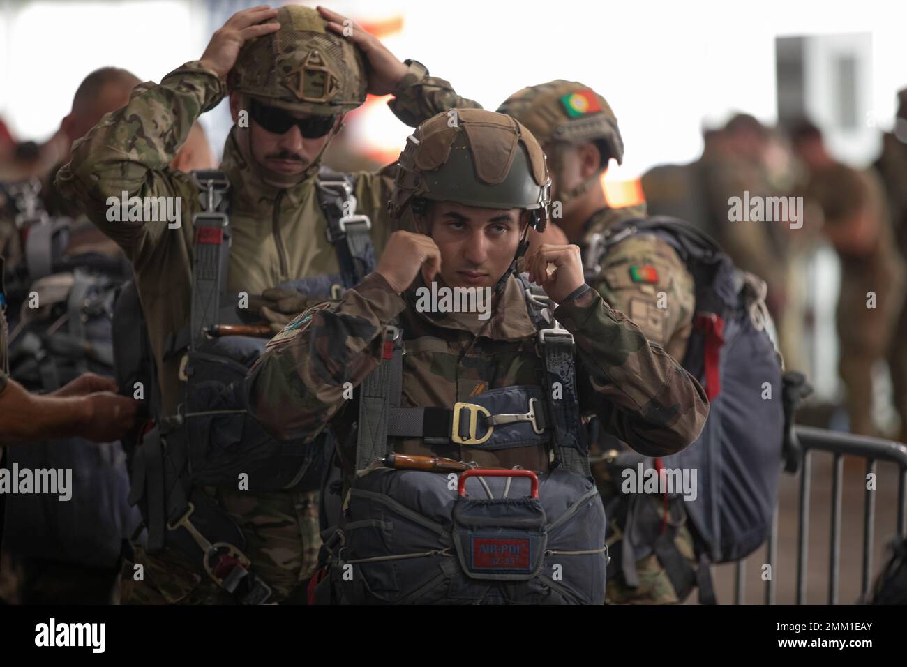 A group of European Paratroopers prepare to jump a Polish parachute ...