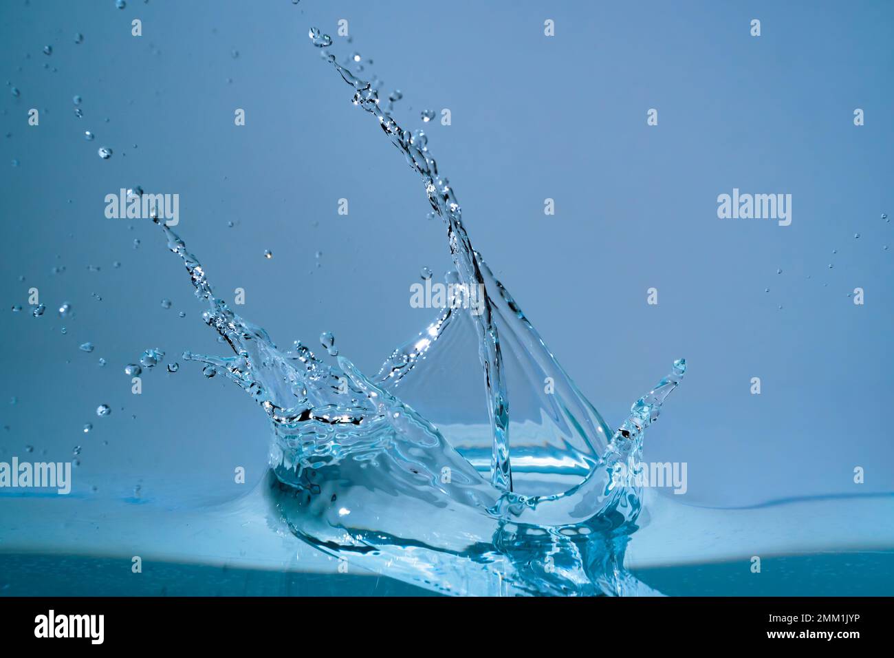 Water fountain and splashing drops above water surface Stock Photo - Alamy