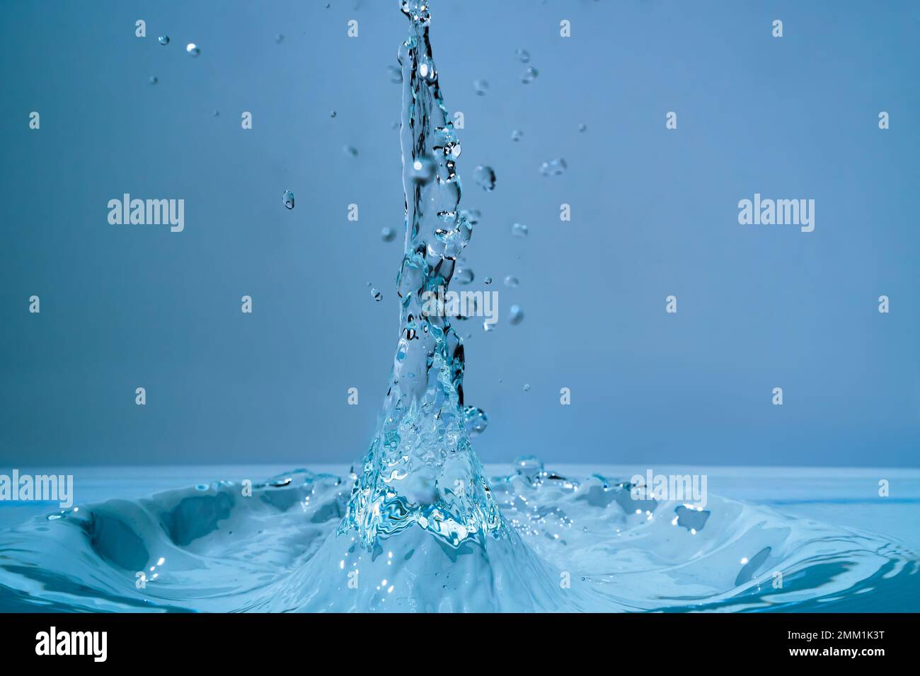 Water fountain and splashing drops above water surface Stock Photo - Alamy