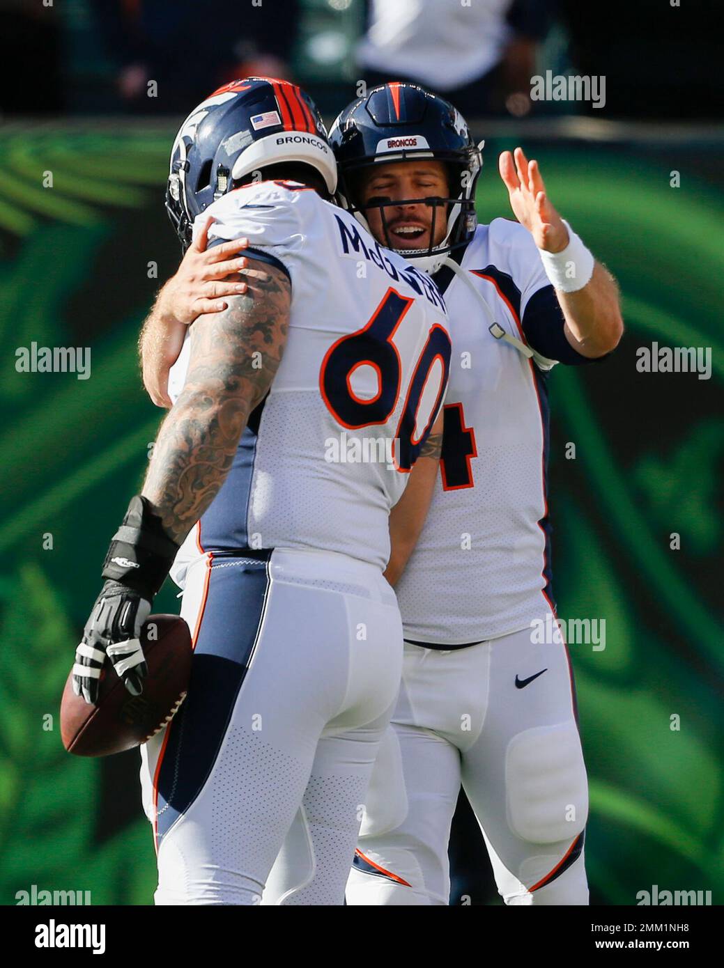 Denver Broncos quarterback Case Keenum (4) meets with linebacker ...