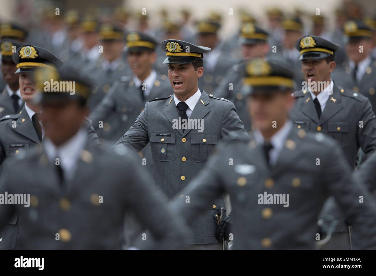 Army cadets sing and march during their graduation ceremony at the ...