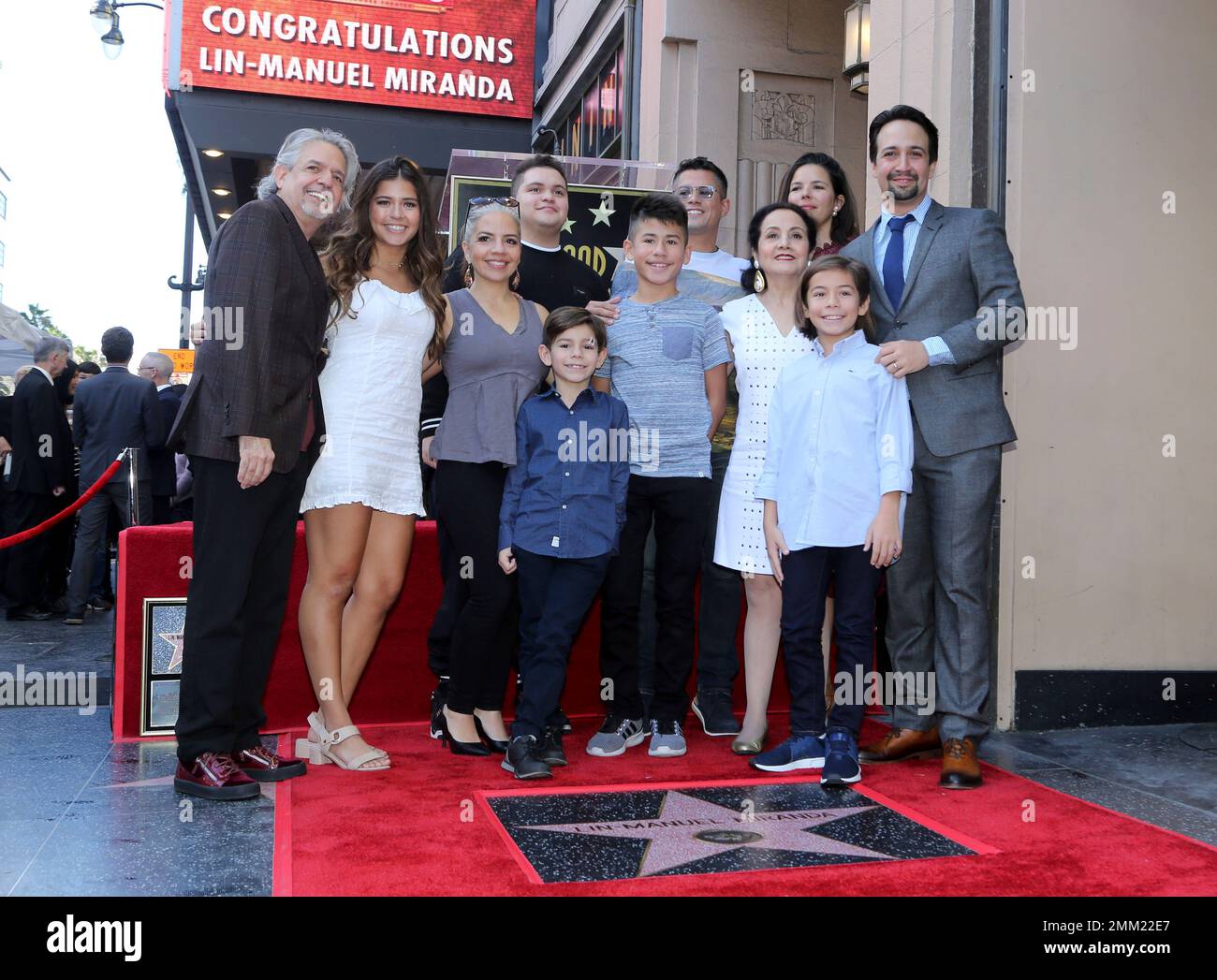 Lin-Manuel Miranda, right, and his family pose atop the star at the ...