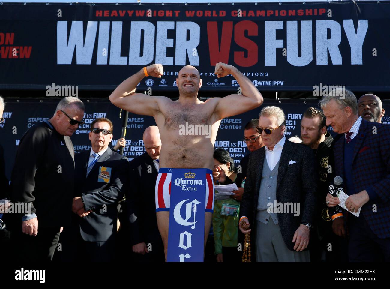 Boxer Tyson Fury flexes during his official weigh-in ceremony Friday ...