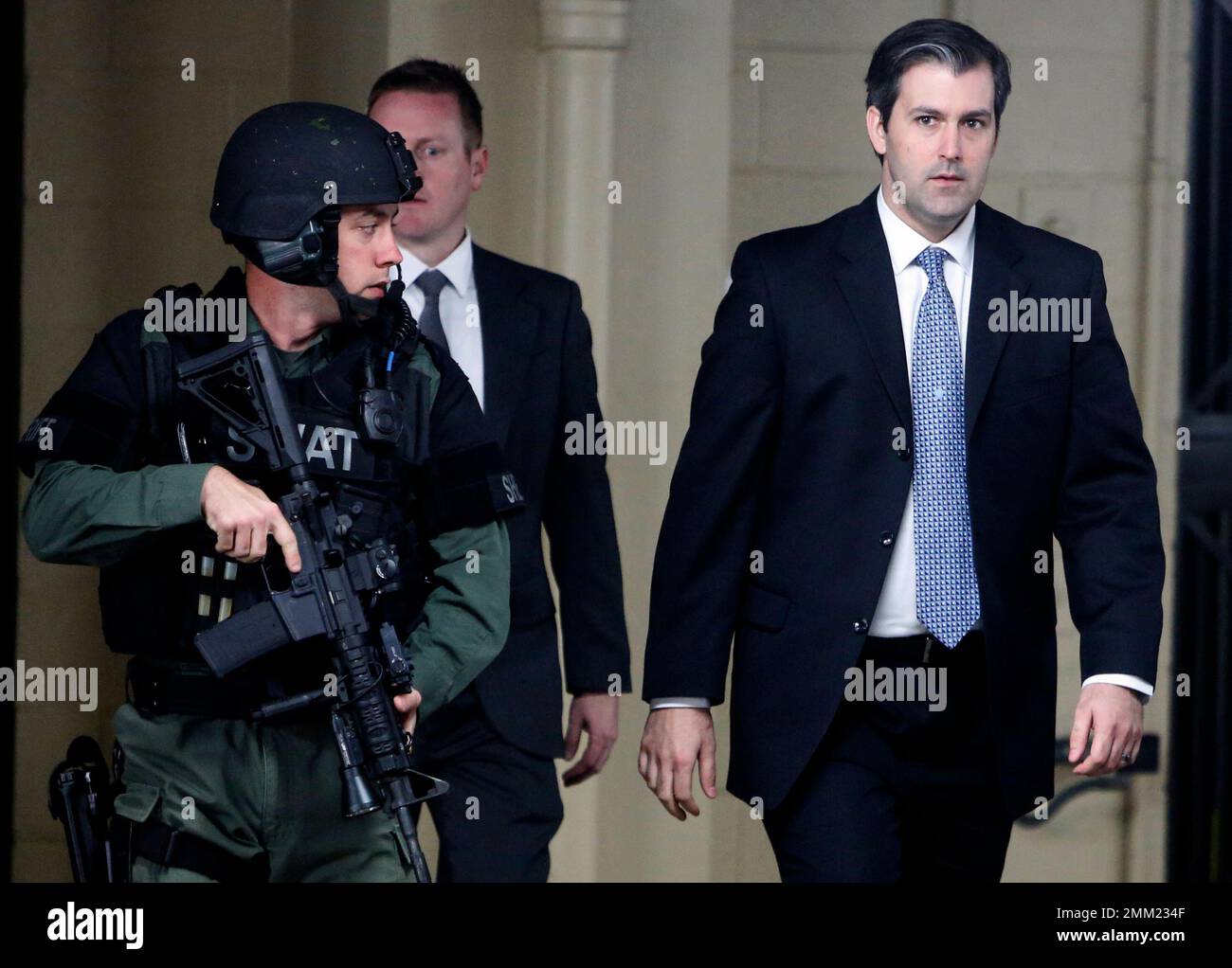 FILE - In this Dec. 5, 2016, file photo, Michael Slager, right, walks from the Charleston County ...