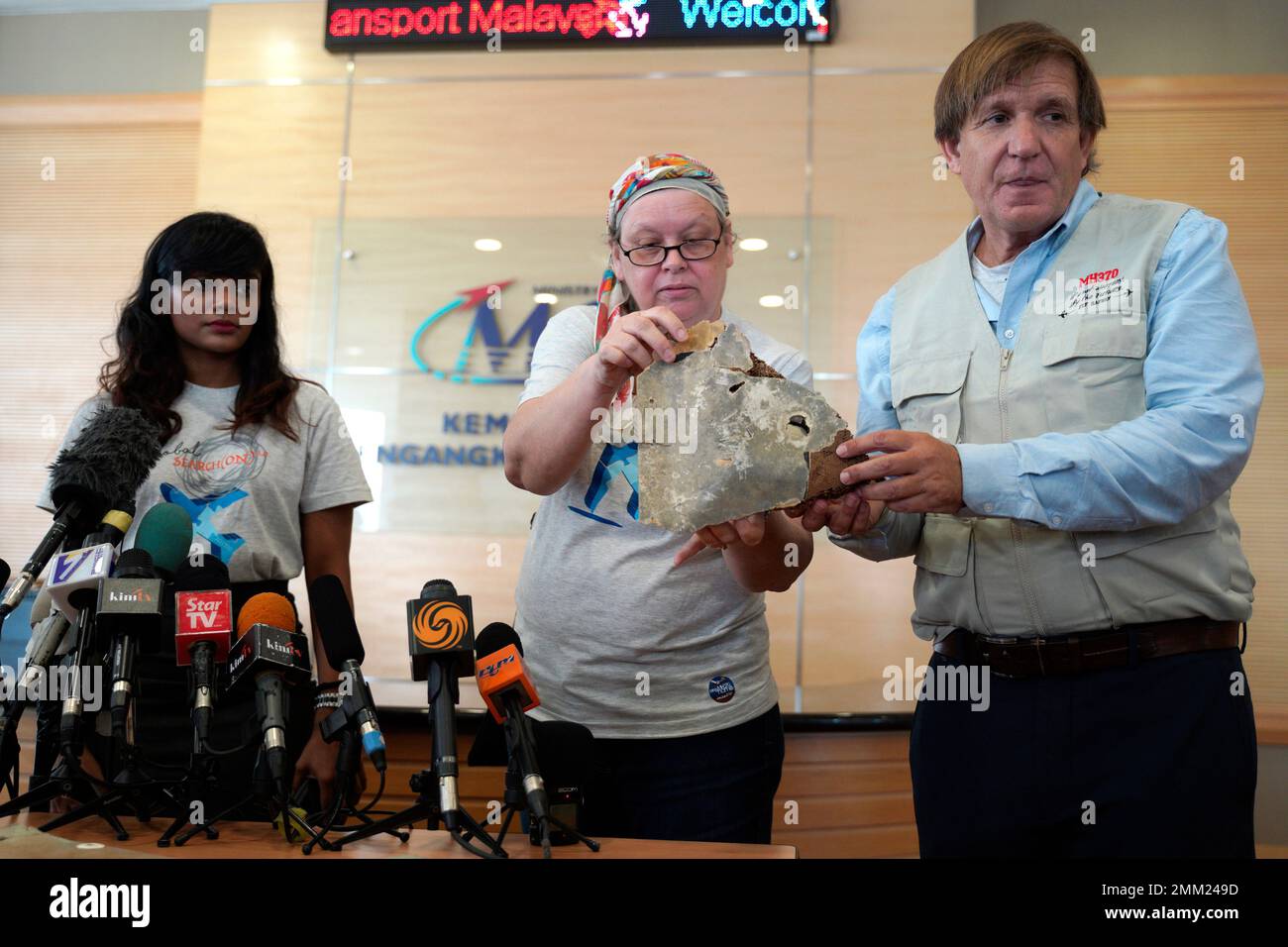 Jacquita Gomes, center, wife of Patrick Gomes, the in-flight supervisor ...