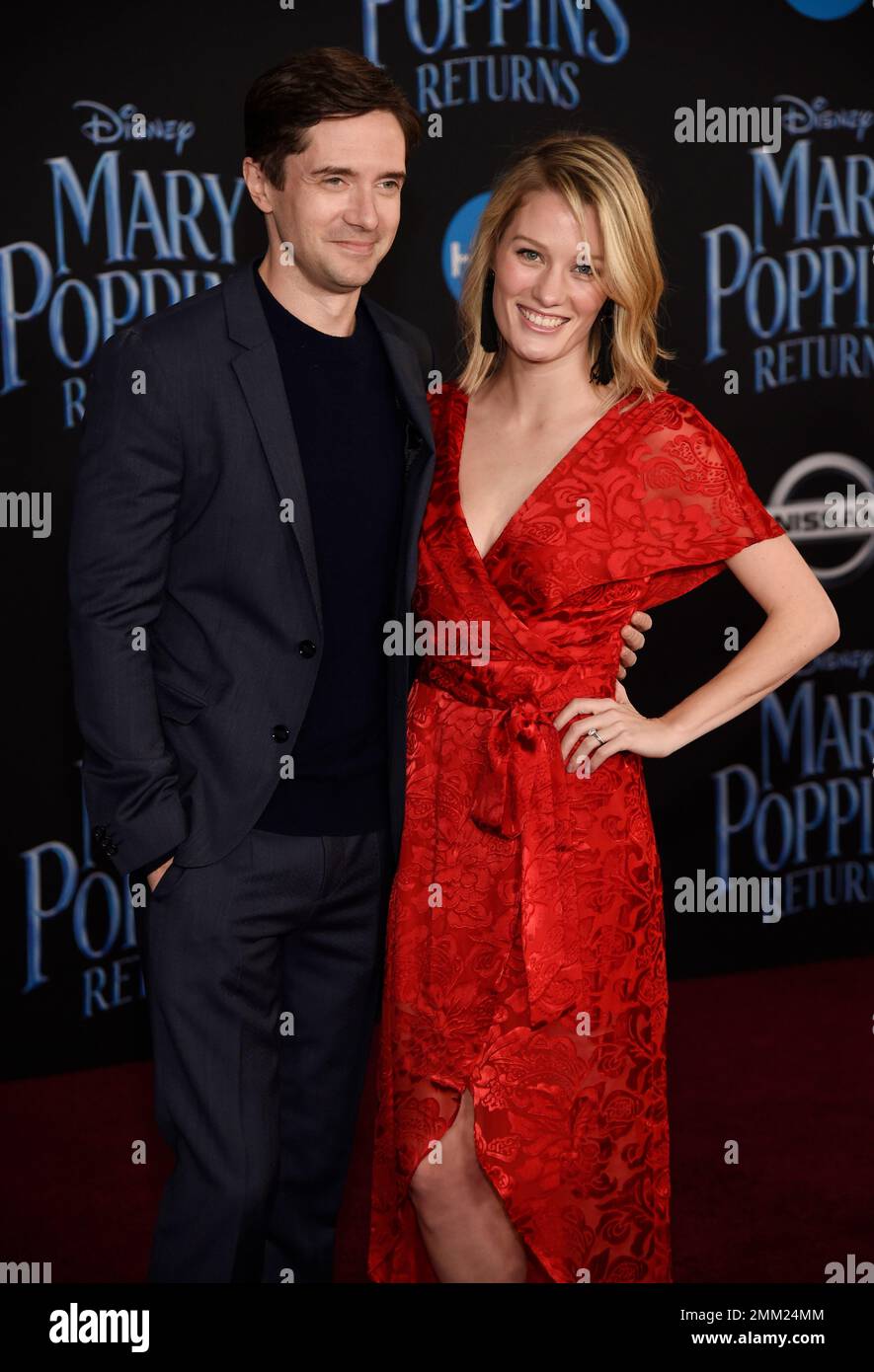 Actor Topher Grace and his wife, actress Ashley Hinshaw, pose together ...