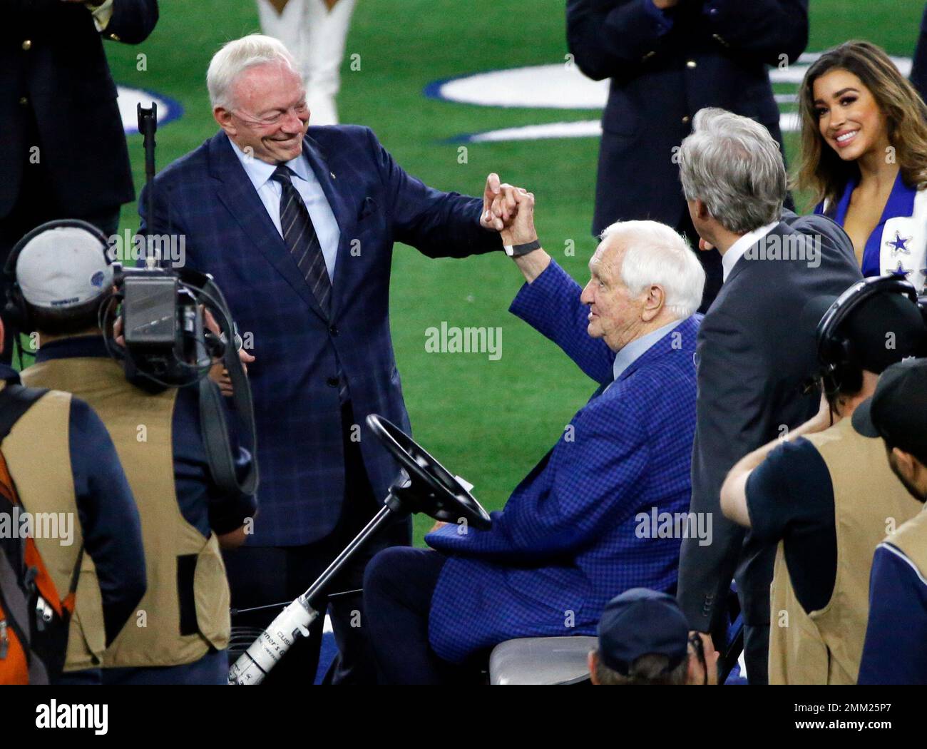 Dallas Cowboys owner Jerry Jones, left, helps induct Gil Brandt, right ...