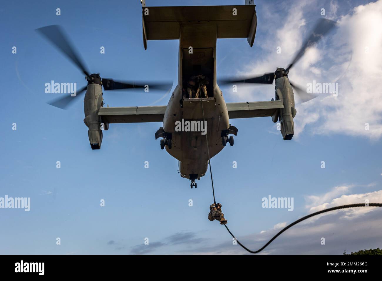 U.S. Marines with III Marine Expeditionary Force (MEF) fast rope from ...