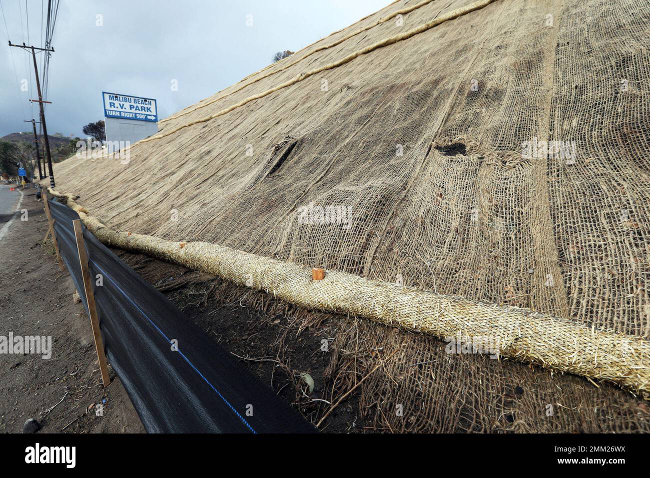 Netting and straw wattle covers a hillside along Pacific Coast Highway ...