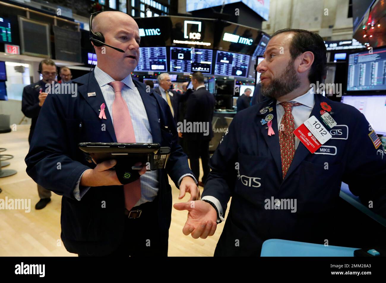 Trader Patrick Casey, left, and specialist Michael Pistillo work on the ...