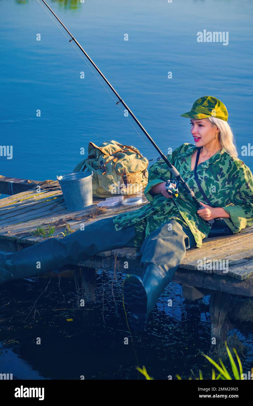 Woman catches fish on rod hi-res stock photography and images - Alamy
