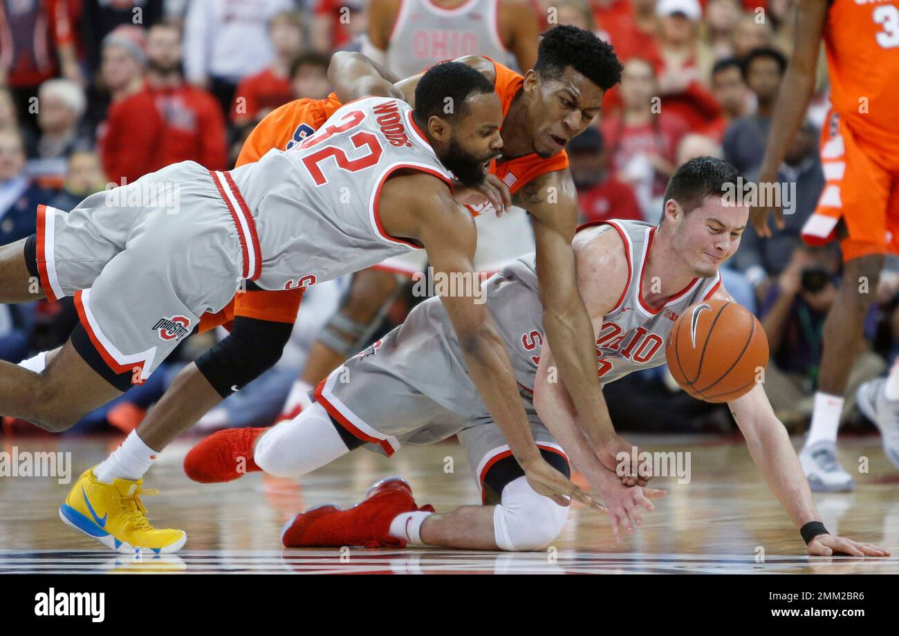 Syracuse's Tyus Battle, center, fights for a loose ball against Ohio ...