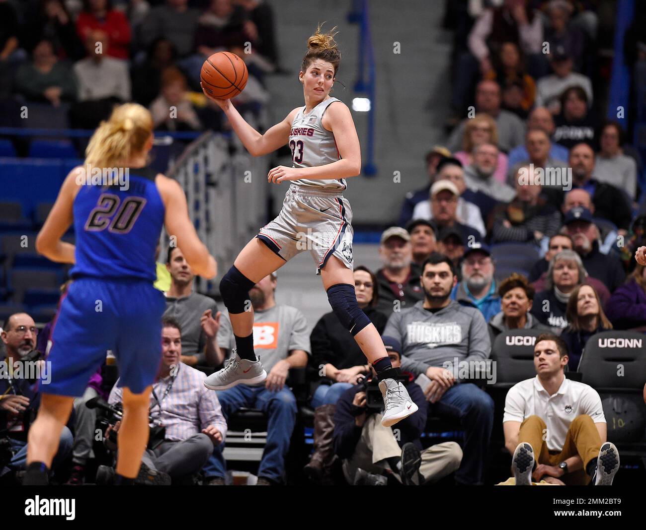 Connecticut's Katie Lou Samuelson leaps to keep a ball in play as ...