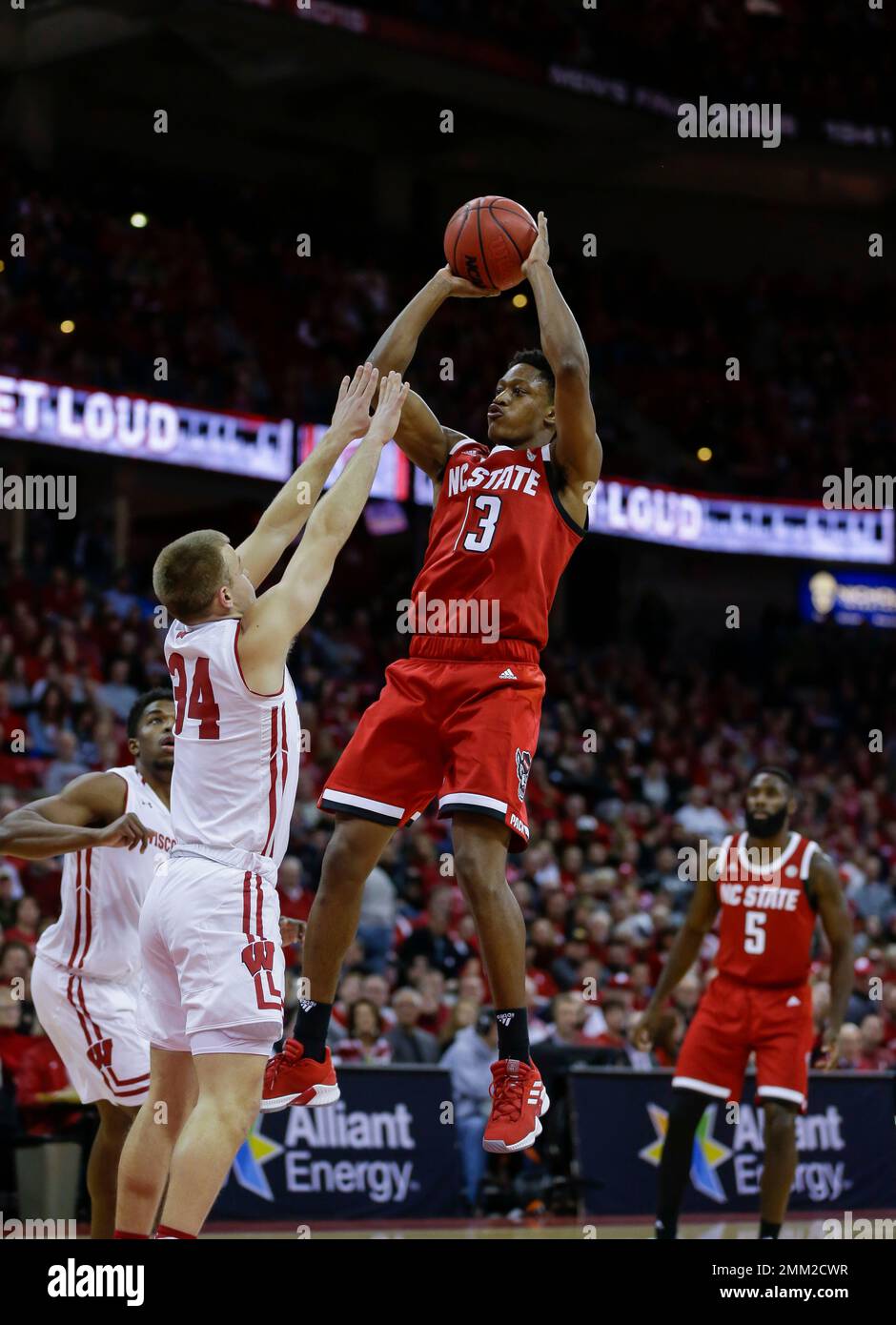 North Carolina State's C.J. Bryce (13) and Wisconsin's Brad Davison (34 ...