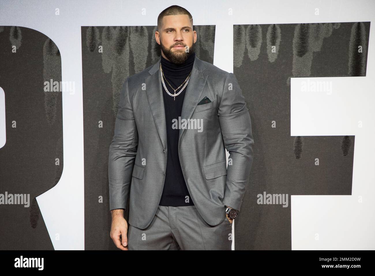 Actor Florian Munteanu poses for photographers upon arrival at the ...