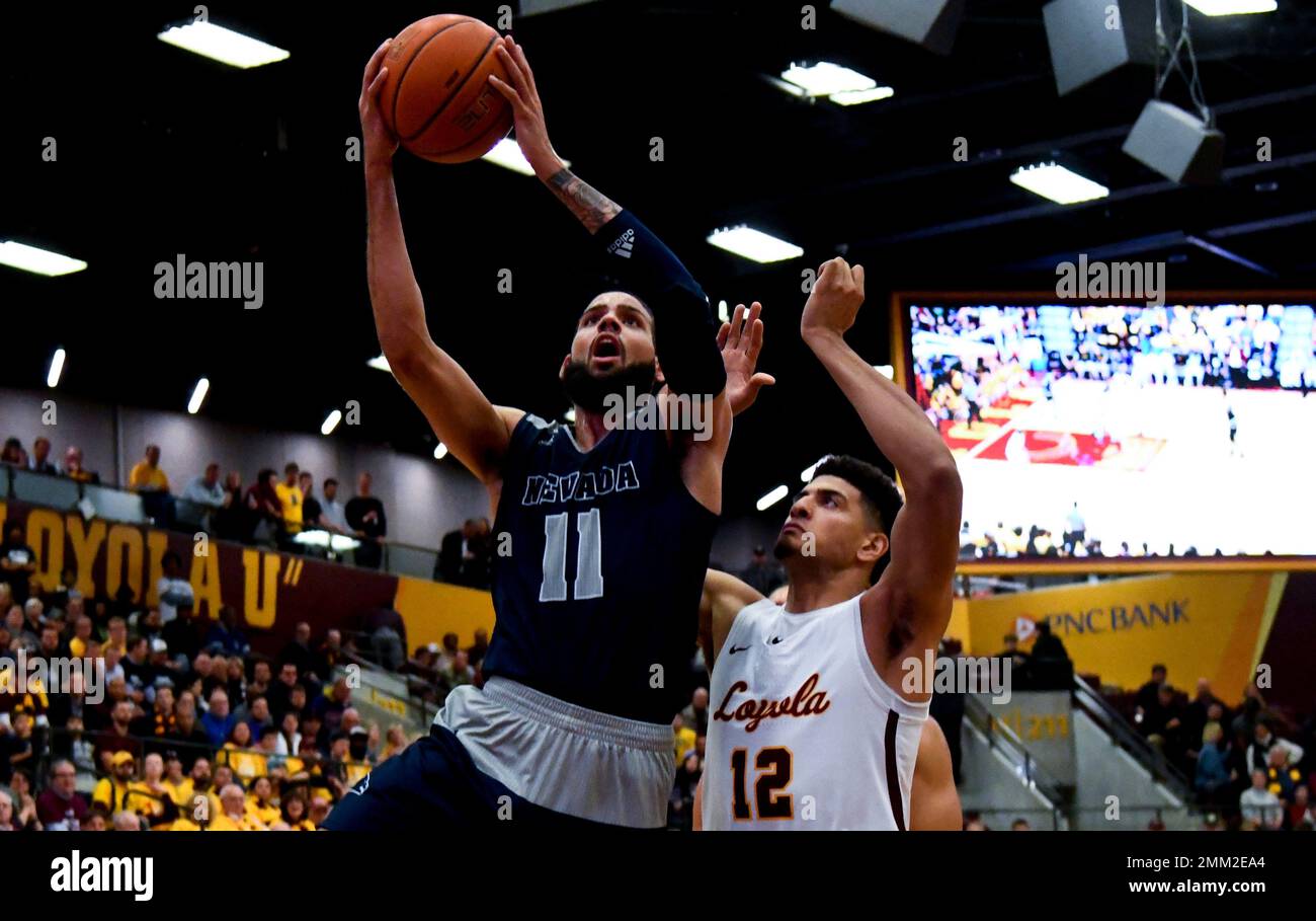 Nevada forward Cody Martin (11) shoots against Loyola of Chicago ...