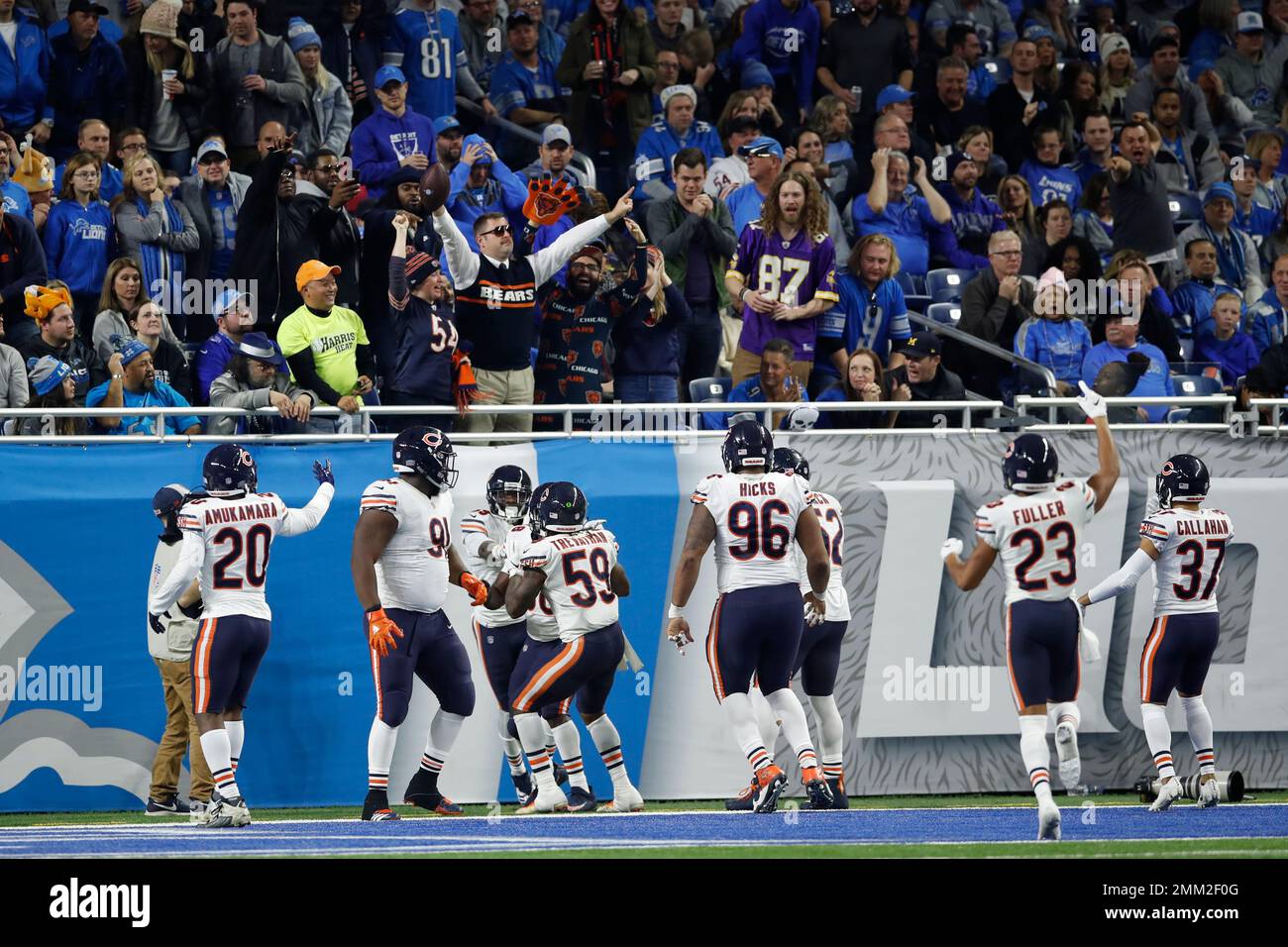 A Chicago Bears fan reacts with the defense after an interception for a ...