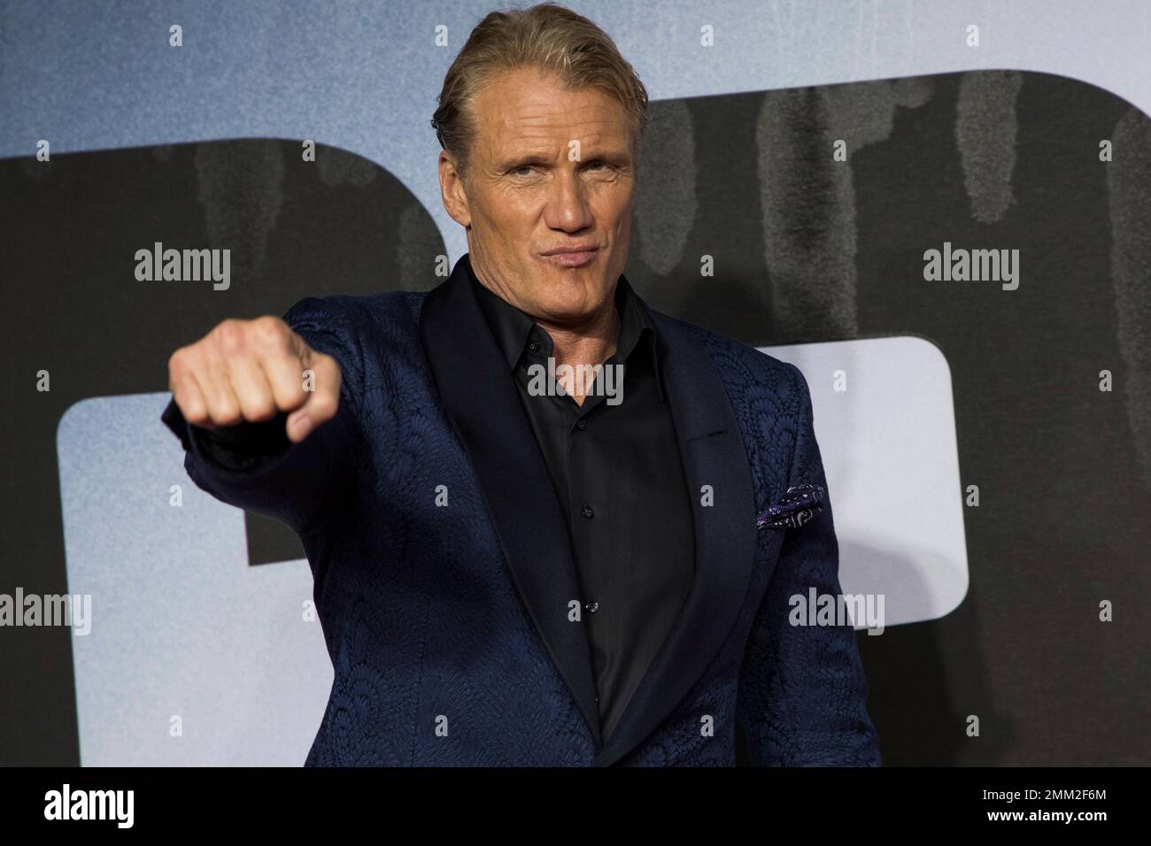 Actor Dolph Lundgren poses for photographers upon arrival at the ...