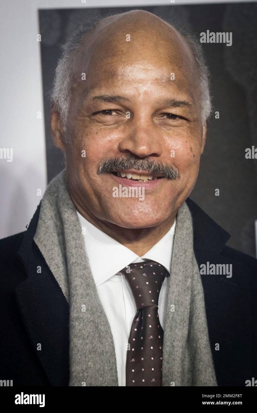Former boxer John Conteh poses for photographers upon arrival at the ...