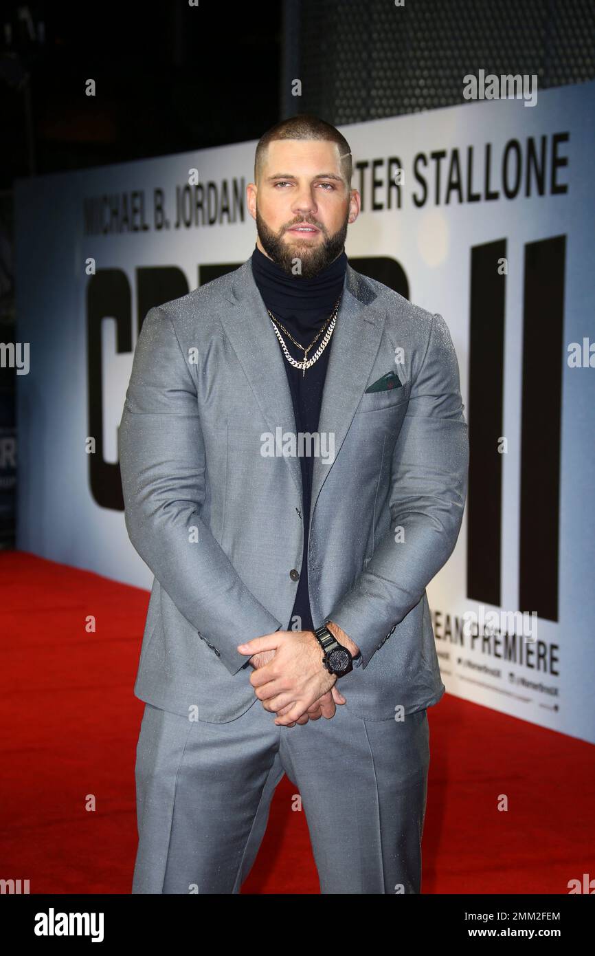Actor Florian Munteanu poses for photographers upon arrival at the ...