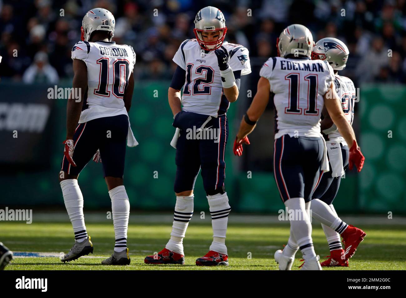 New England Patriots quarterback Tom Brady (12) gestures towards Julian ...