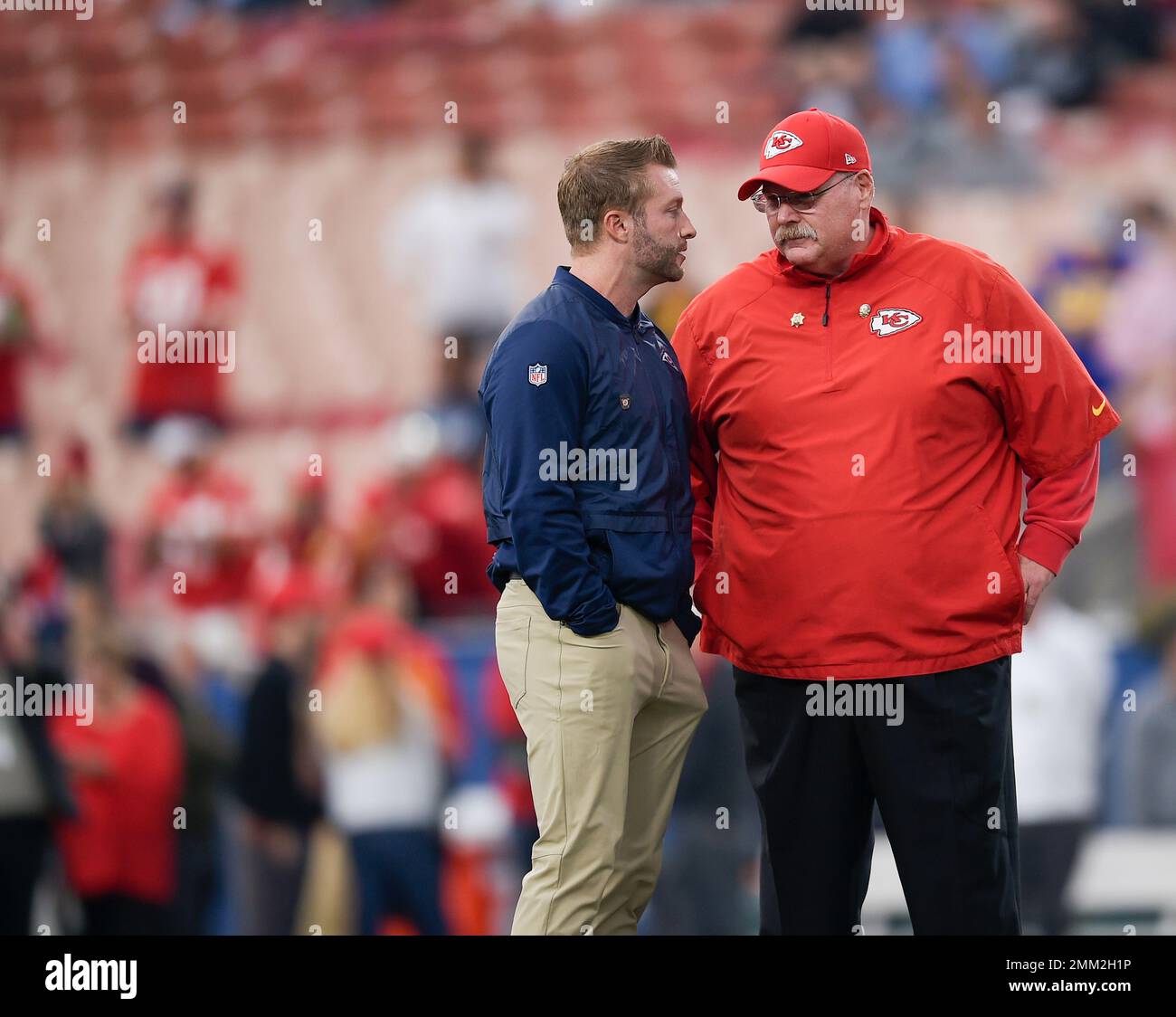 Kansas City Chiefs head coach Andy Reid, right, talks with Los Angeles ...