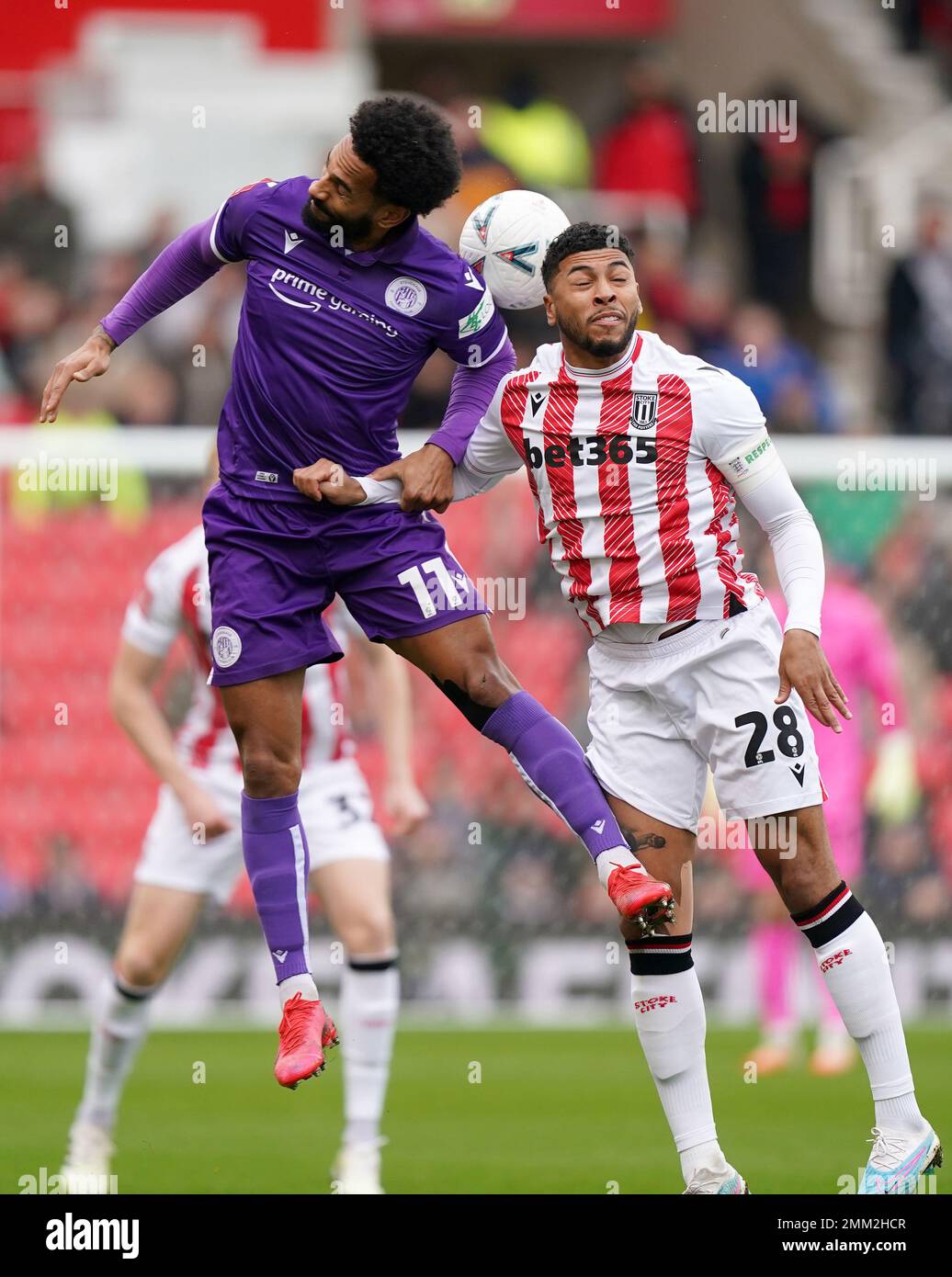 Stevenage's Jordan Roberts (left) and Stoke City's Josh Laurent battle ...